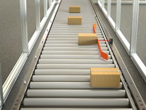 Push-Arm Alignment of Corrugated Boxes on a Conveyor